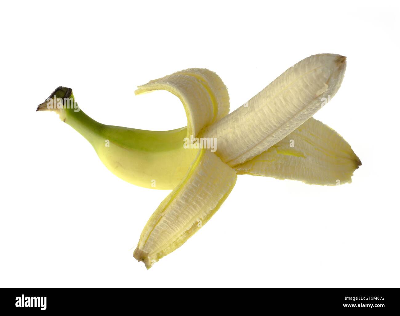 One ripe banana, half peeled on a white background, isolated Stock ...