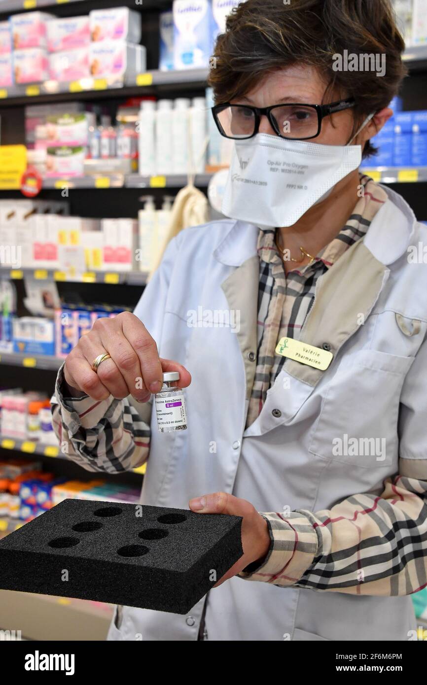 Pharmacist holds up a vial of Astra Zeneca Covid- 19 vaccine in the ...