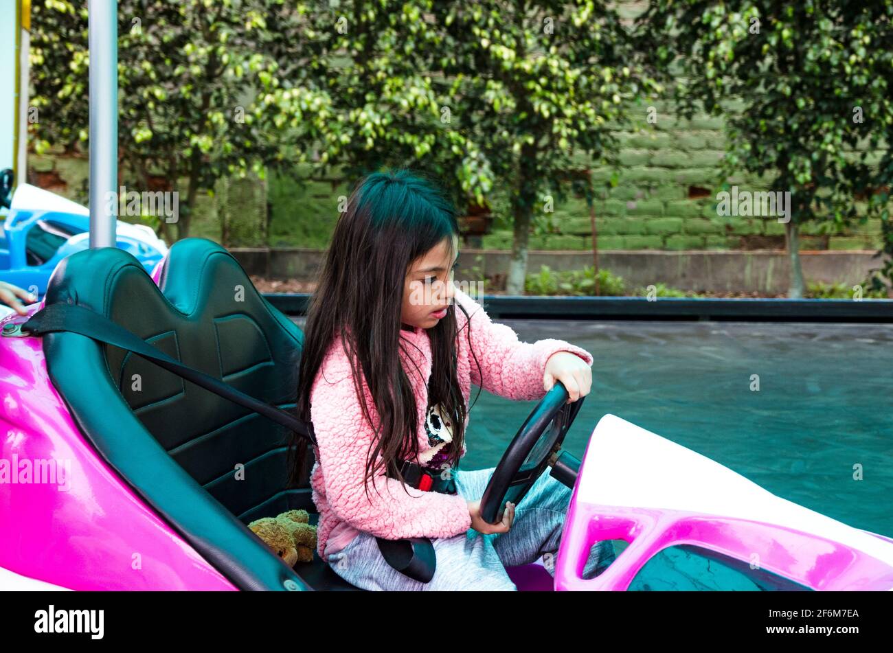 Boy driving a bumper car. Motion blur image Stock Photo - Alamy