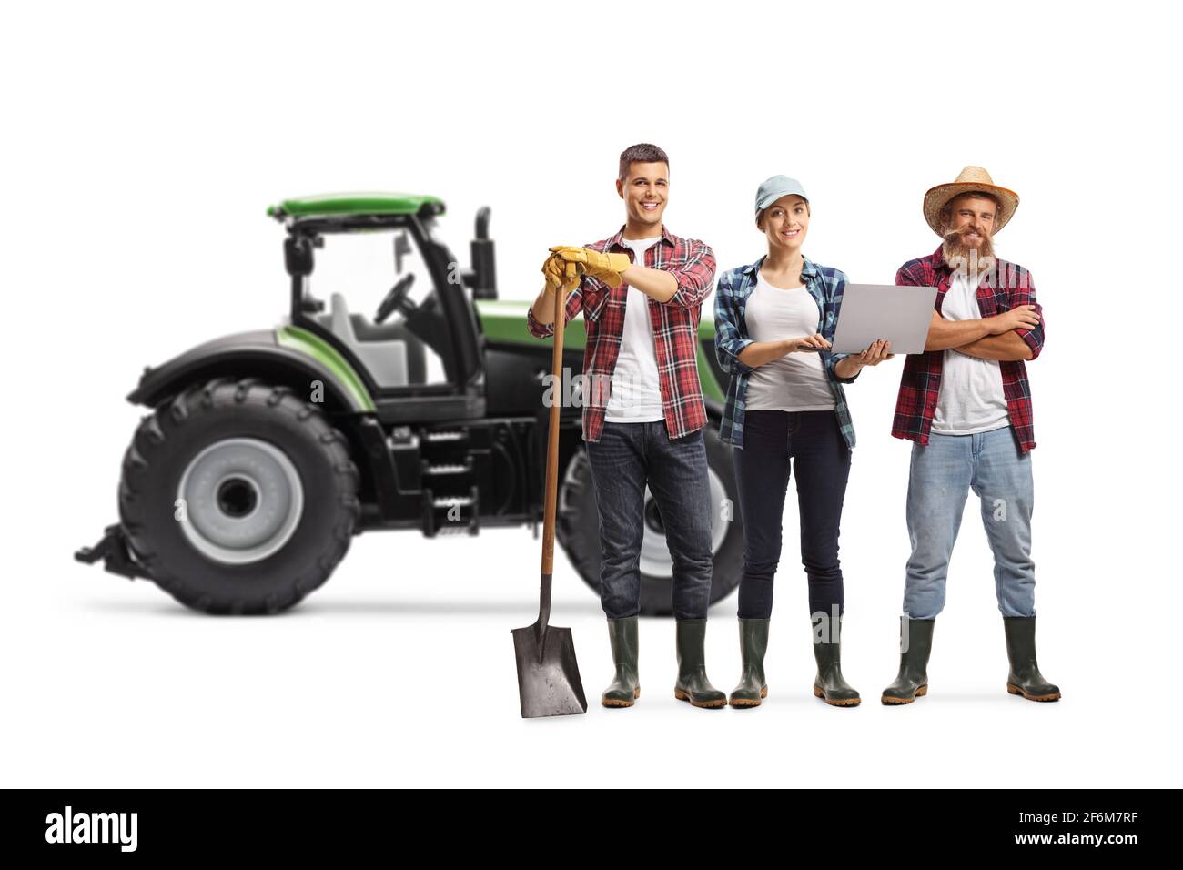 Full length portrait of group of young farmers with a tractor isolated ...