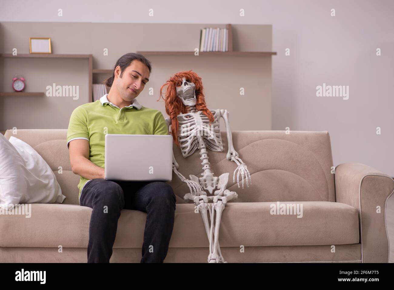 Human skeleton sitting with laptop computer hi-res stock photography ...