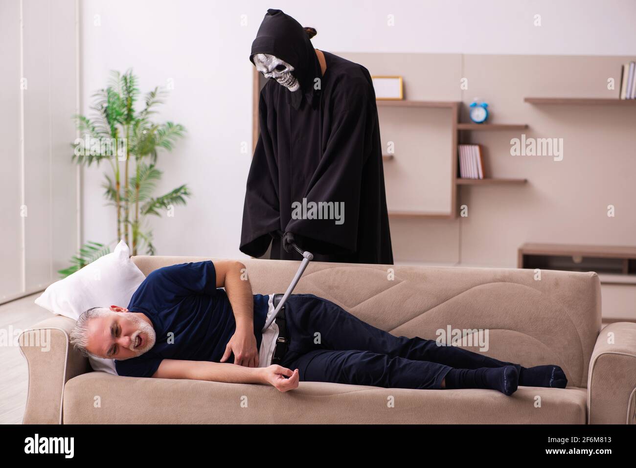 Devil coming to old dying man Stock Photo - Alamy