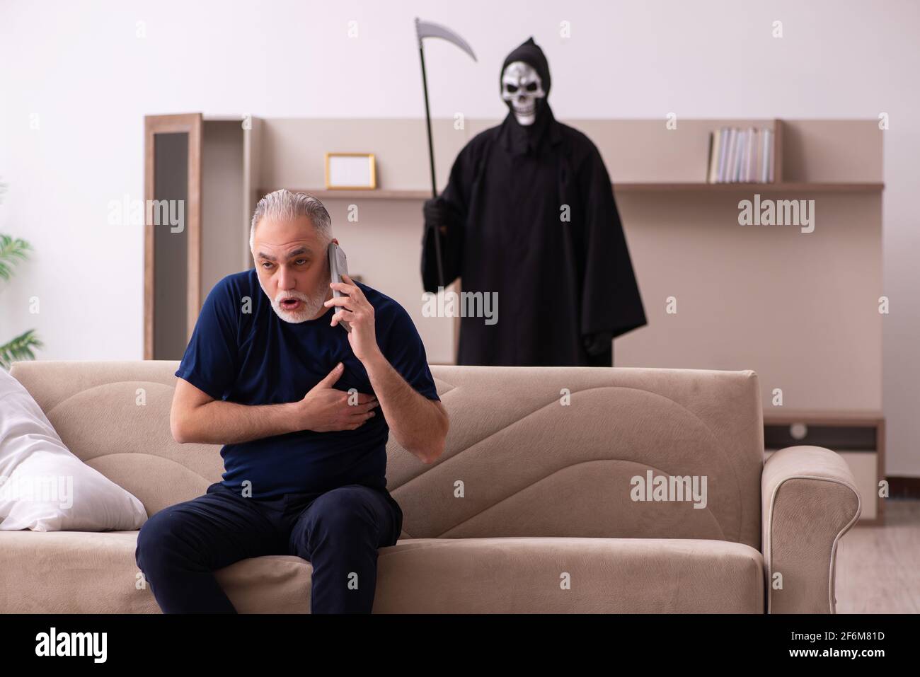 Devil coming to old dying man Stock Photo - Alamy