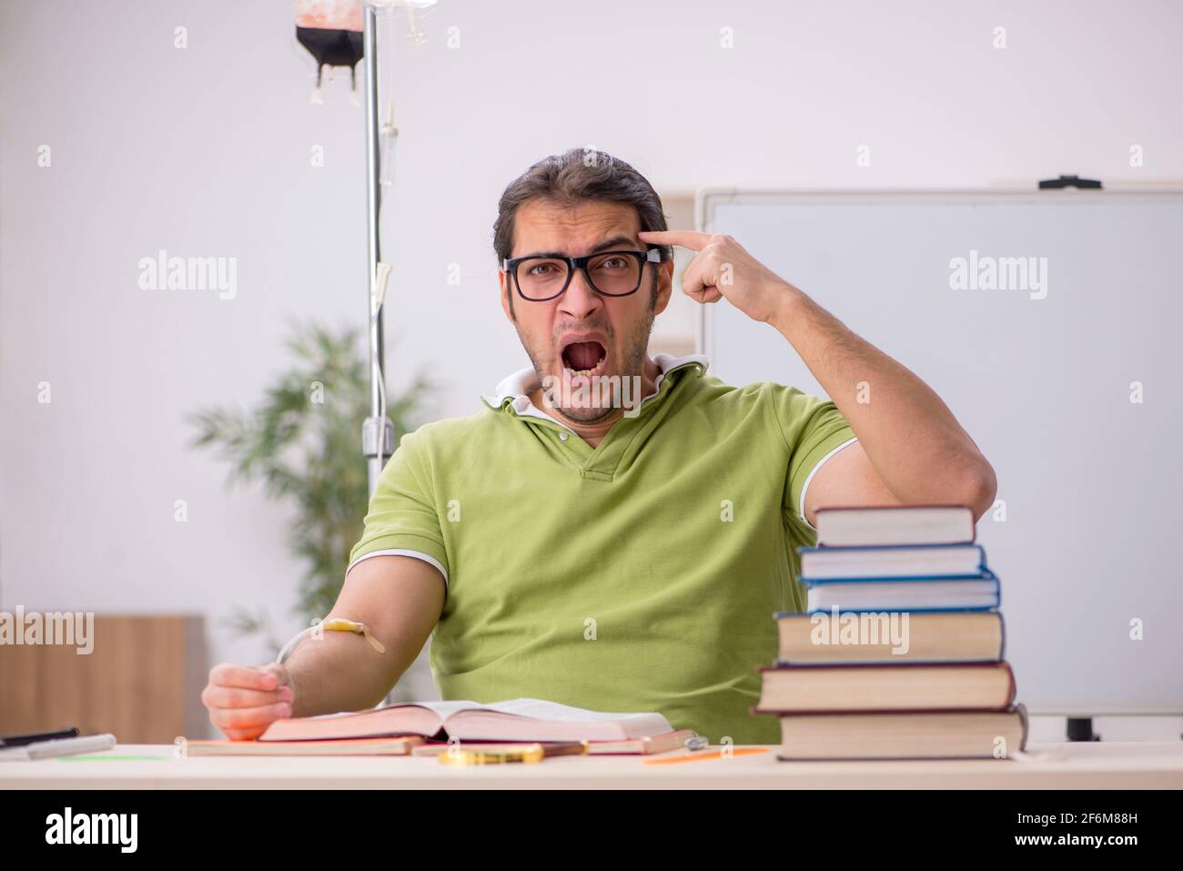 Young sick teacher student in blood transfusion concept Stock Photo - Alamy