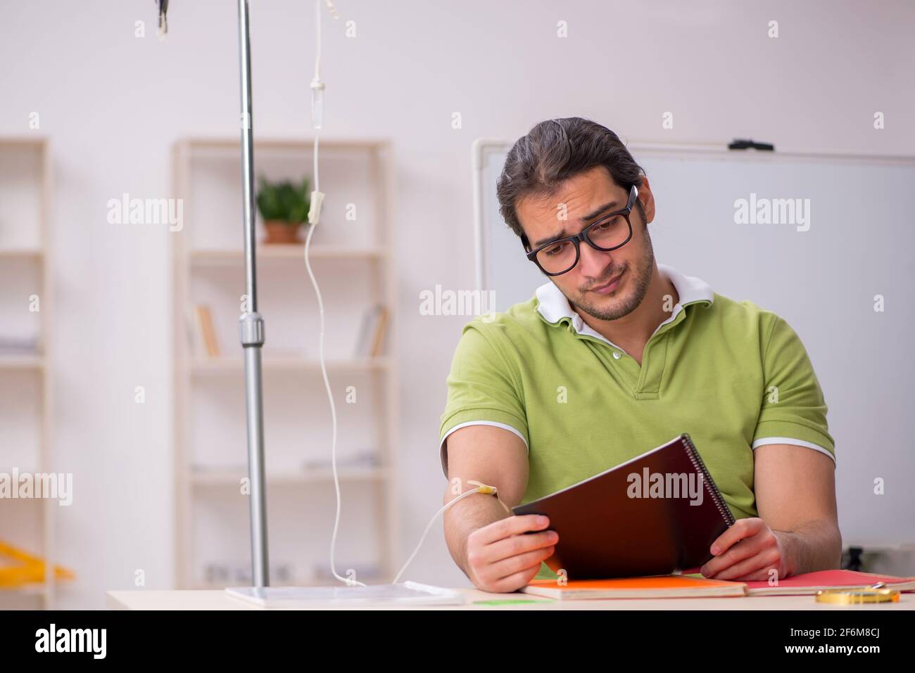 Young sick teacher student in blood transfusion concept Stock Photo - Alamy