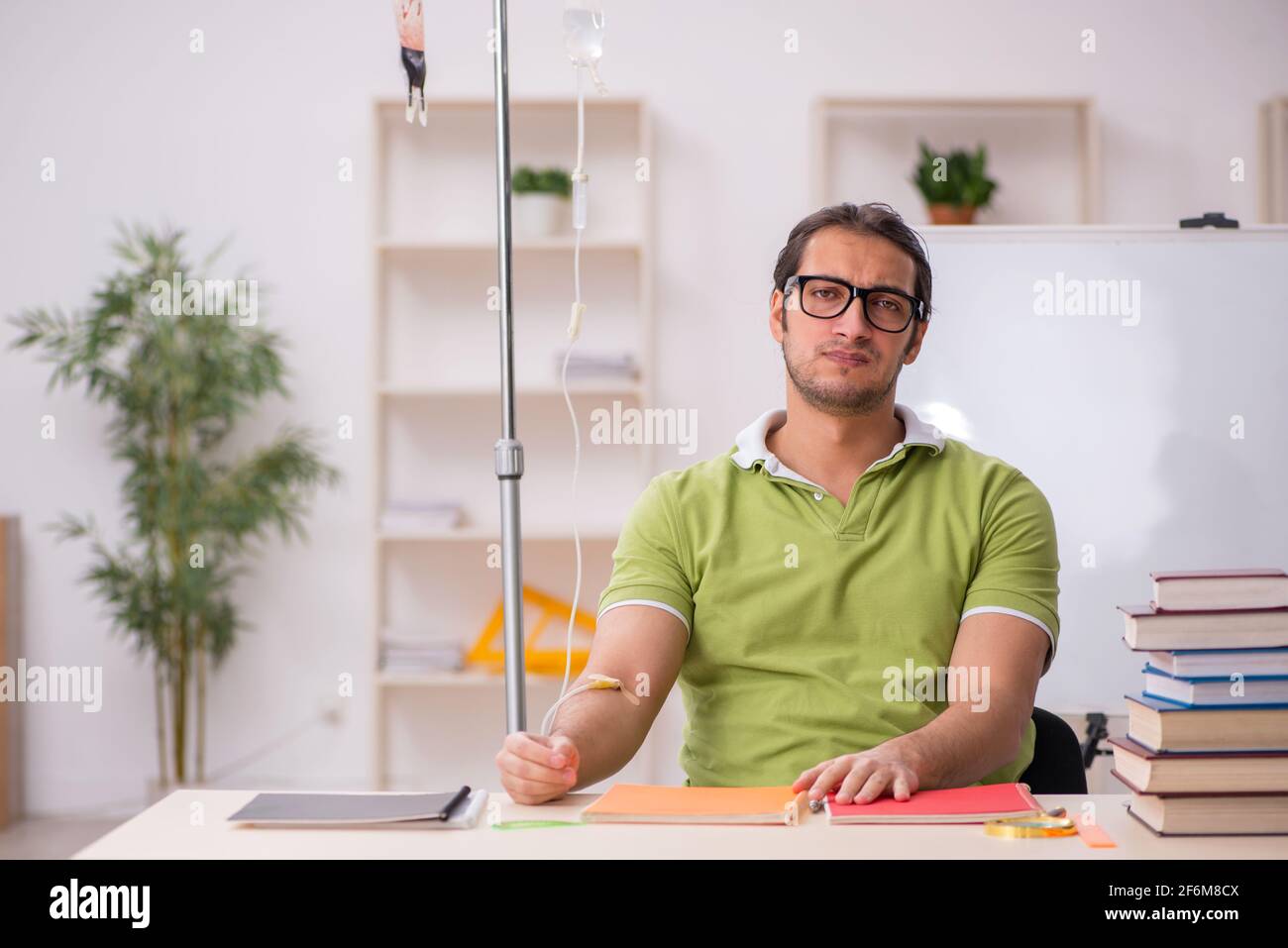 Young sick teacher student in blood transfusion concept Stock Photo - Alamy