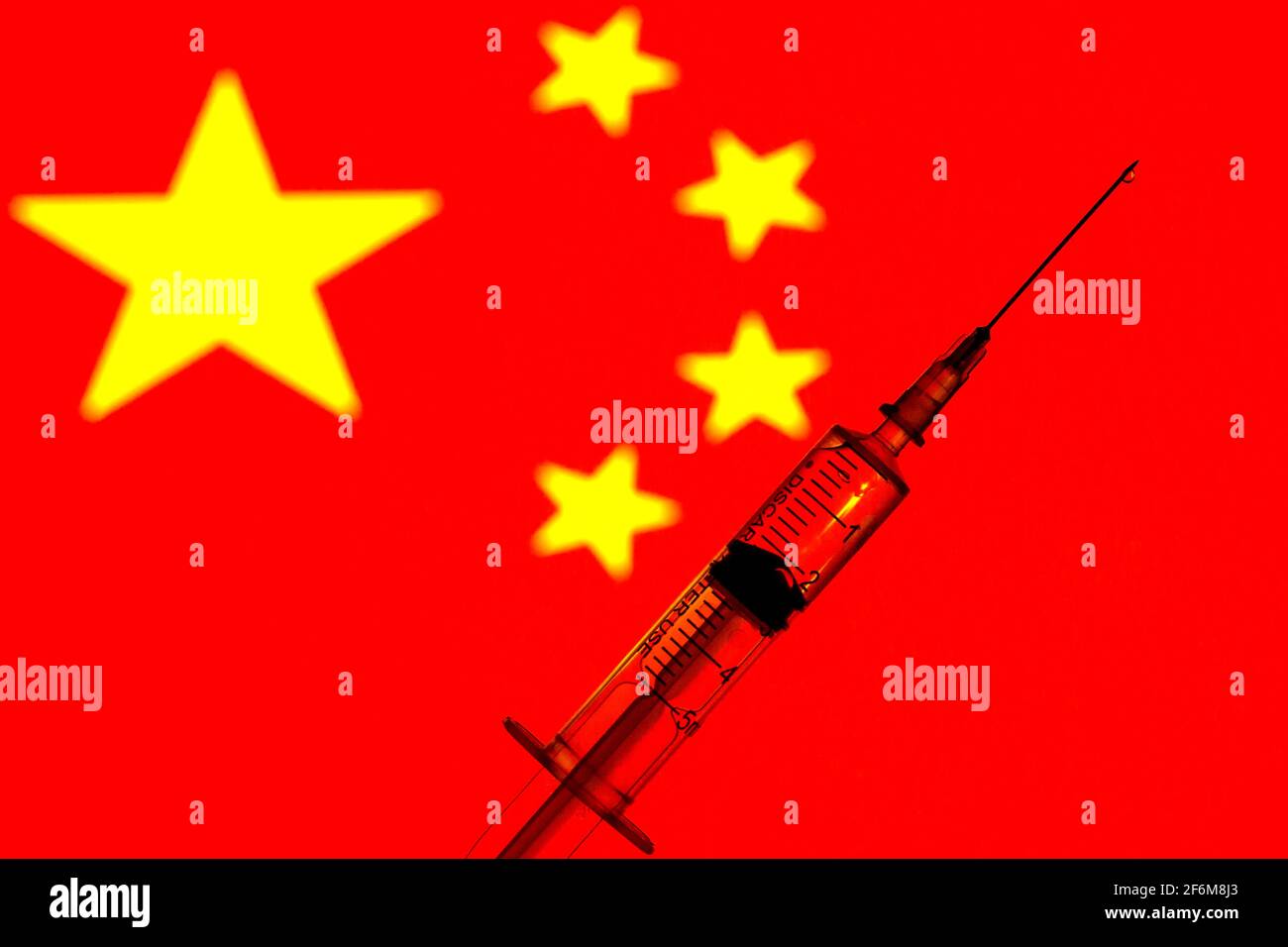 In this photo illustration, a medical syringe seen displayed in front ...