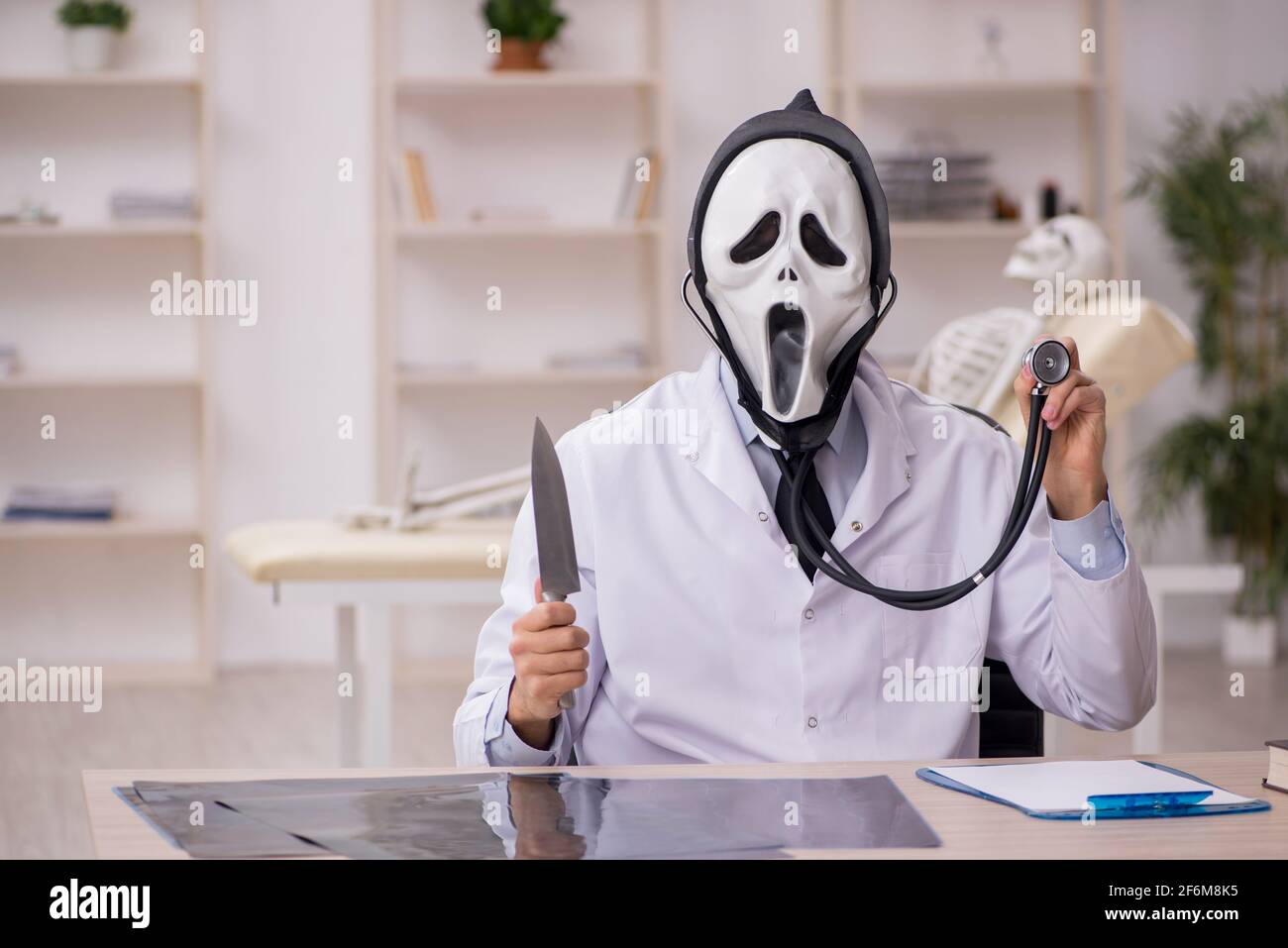Devil doctor working at the hospital Stock Photo - Alamy