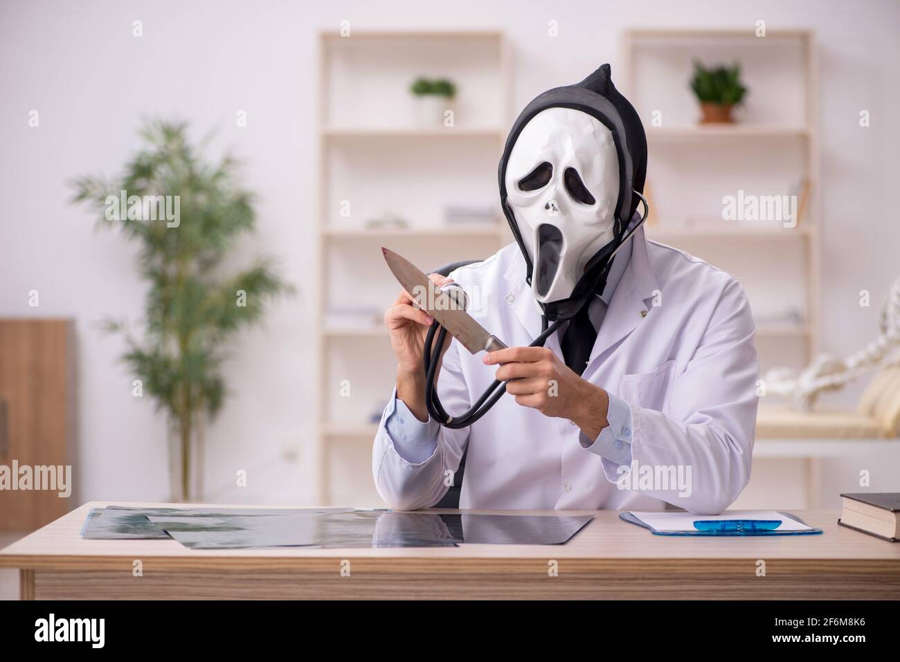 Devil doctor working at the hospital Stock Photo - Alamy