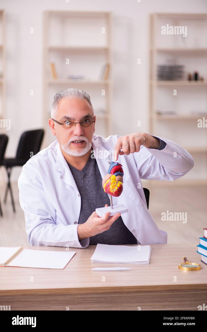 Old doctor cardiologist sitting in the classroom Stock Photo - Alamy