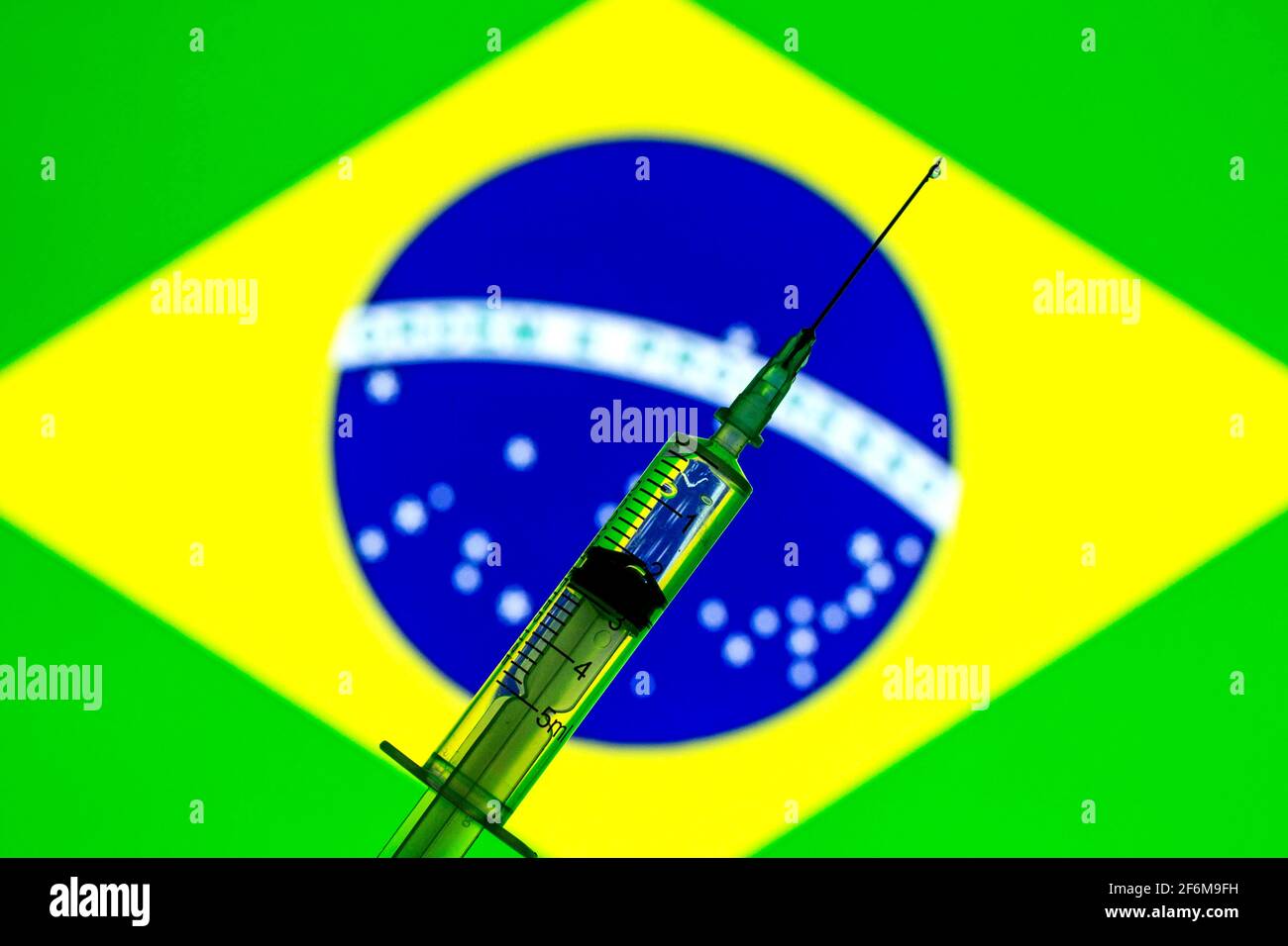 In this photo illustration, a medical syringe seen displayed in front ...