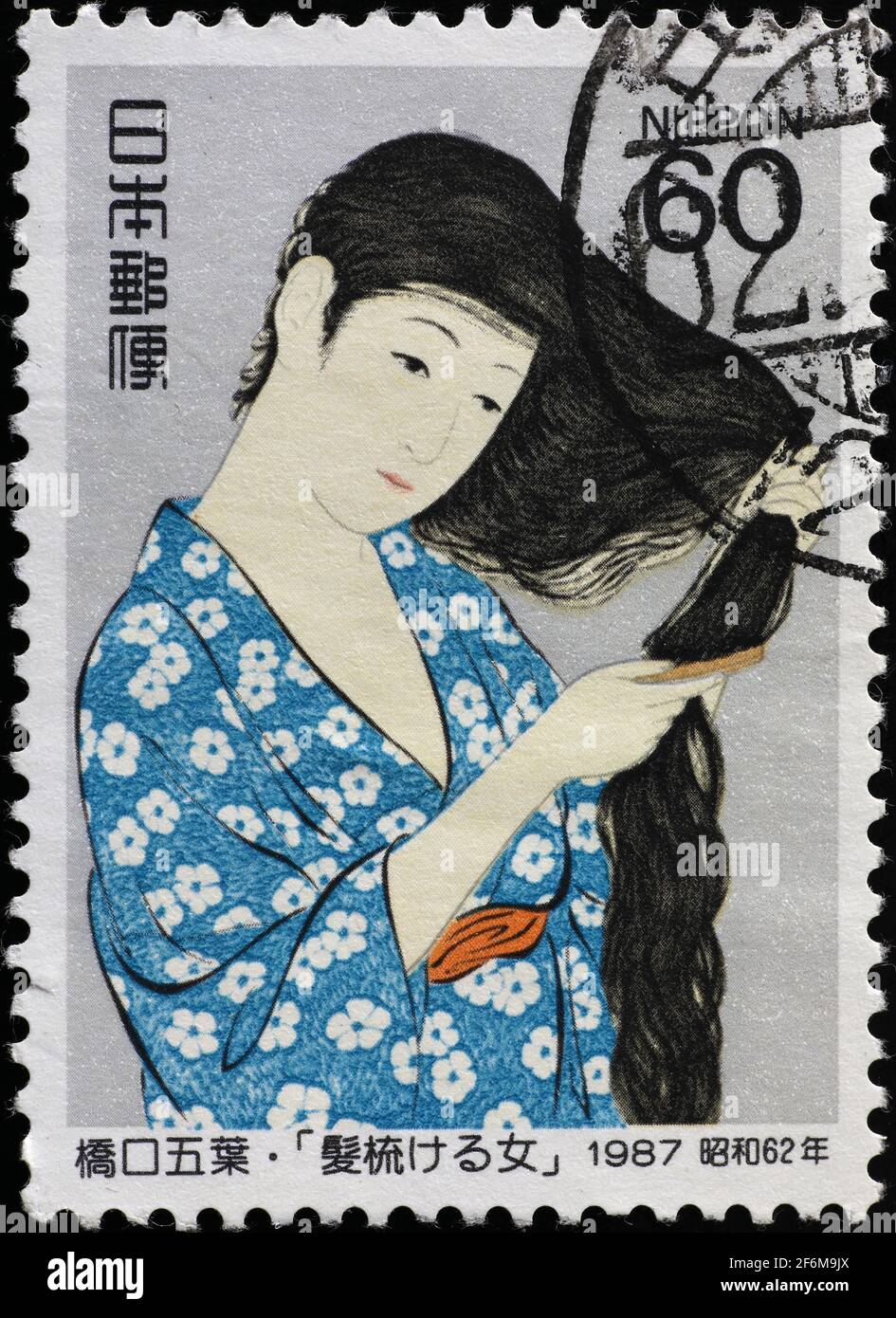 Japanese woman combing her hair on postage stamp Stock Photo - Alamy