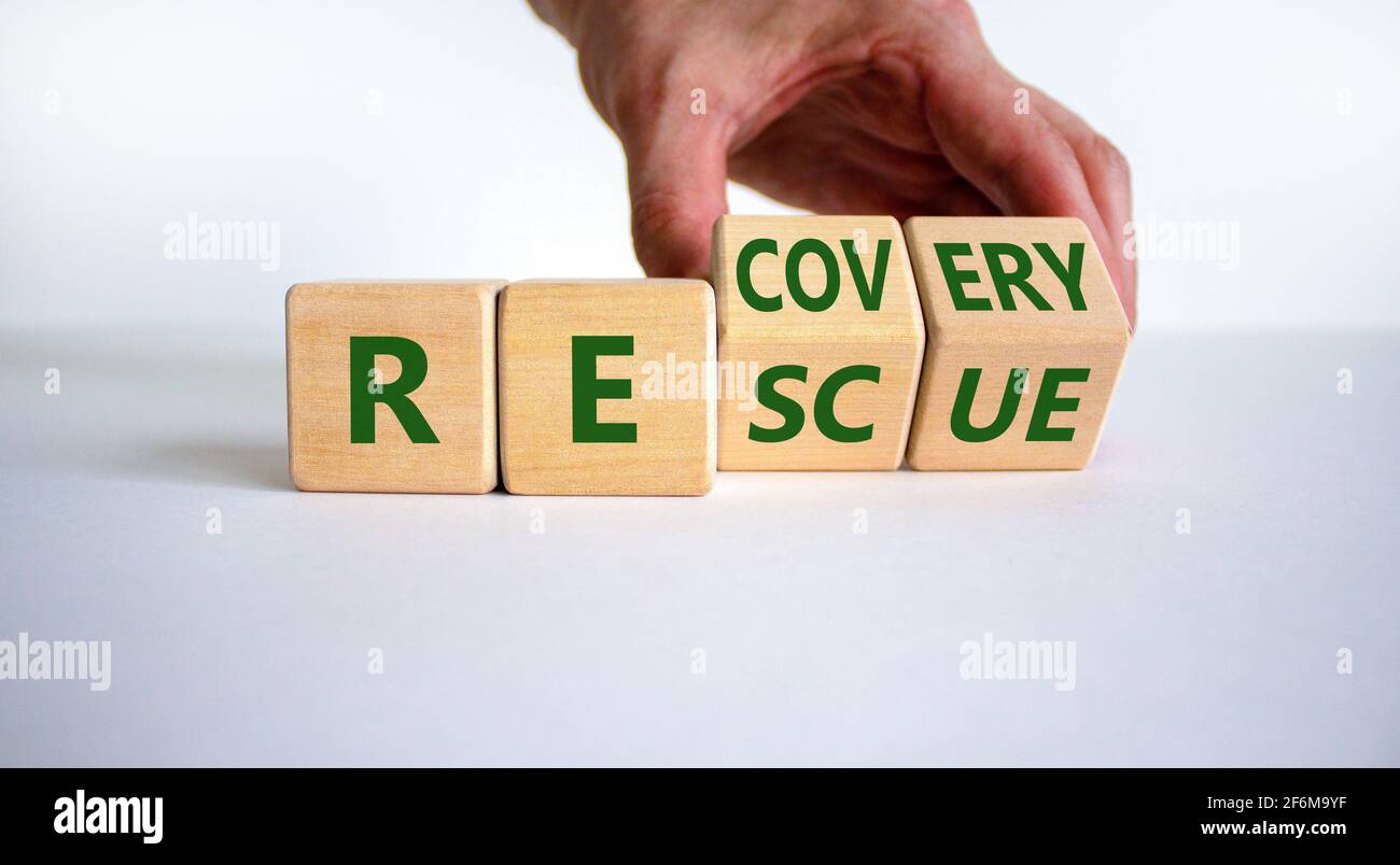 Recovery and rescue symbol. Businessman turns cubes and changes the ...