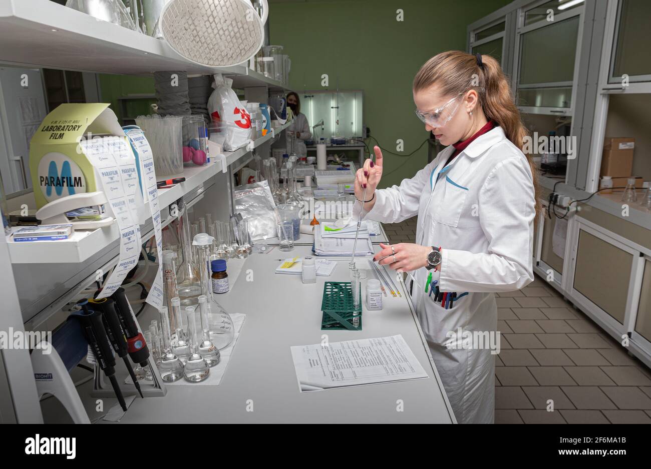 Conducting chemical and biological experiments in the laboratory Stock ...