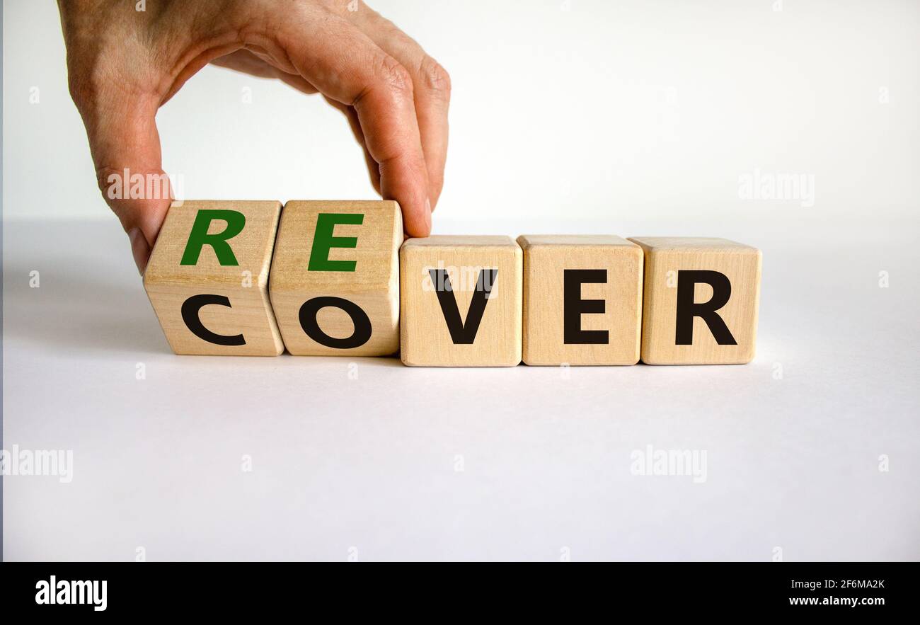 Recover symbol. Concept word 'recover' on wooden cubes on a beautiful ...
