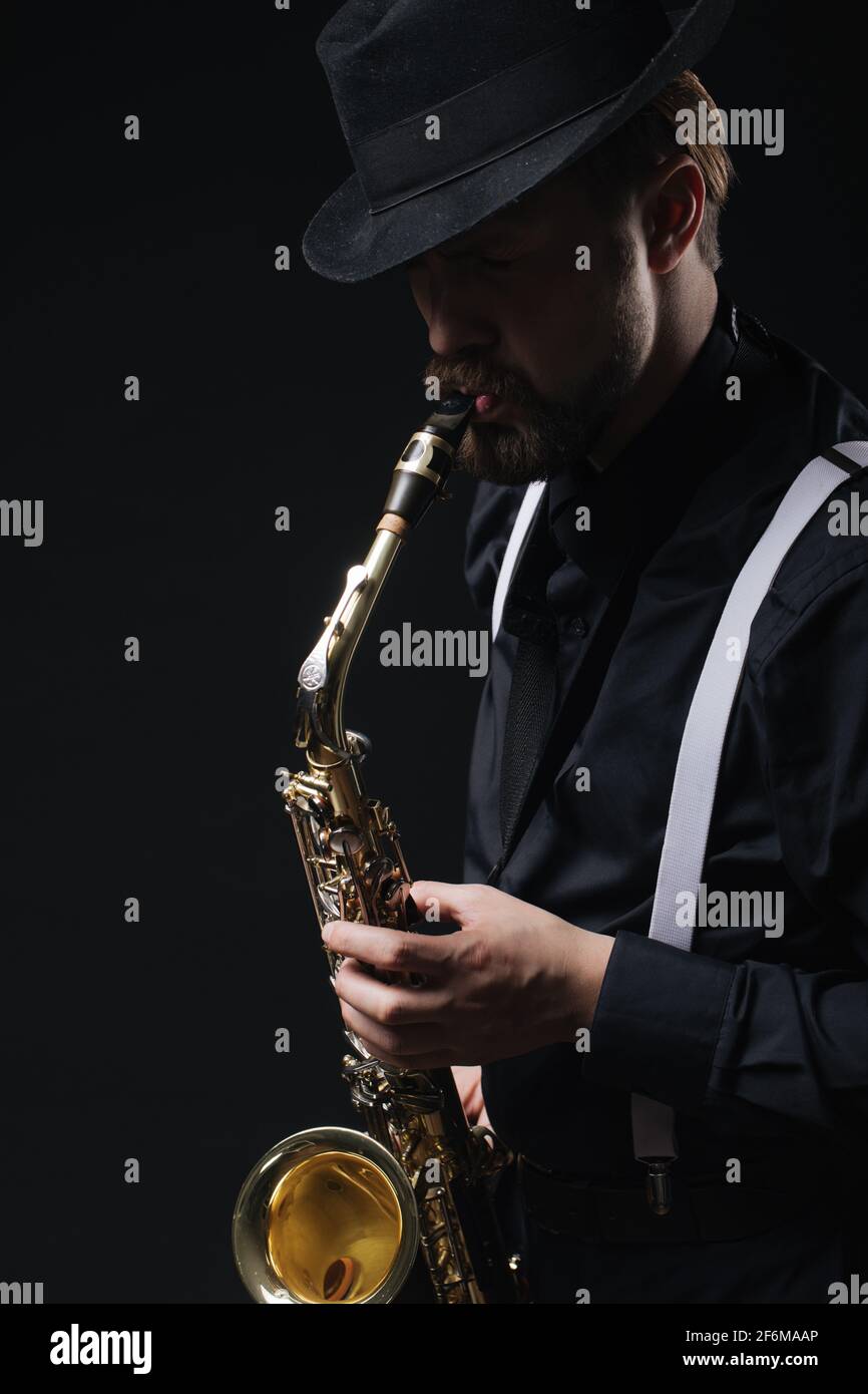 Jazzman playing on saxophone Stock Photo - Alamy