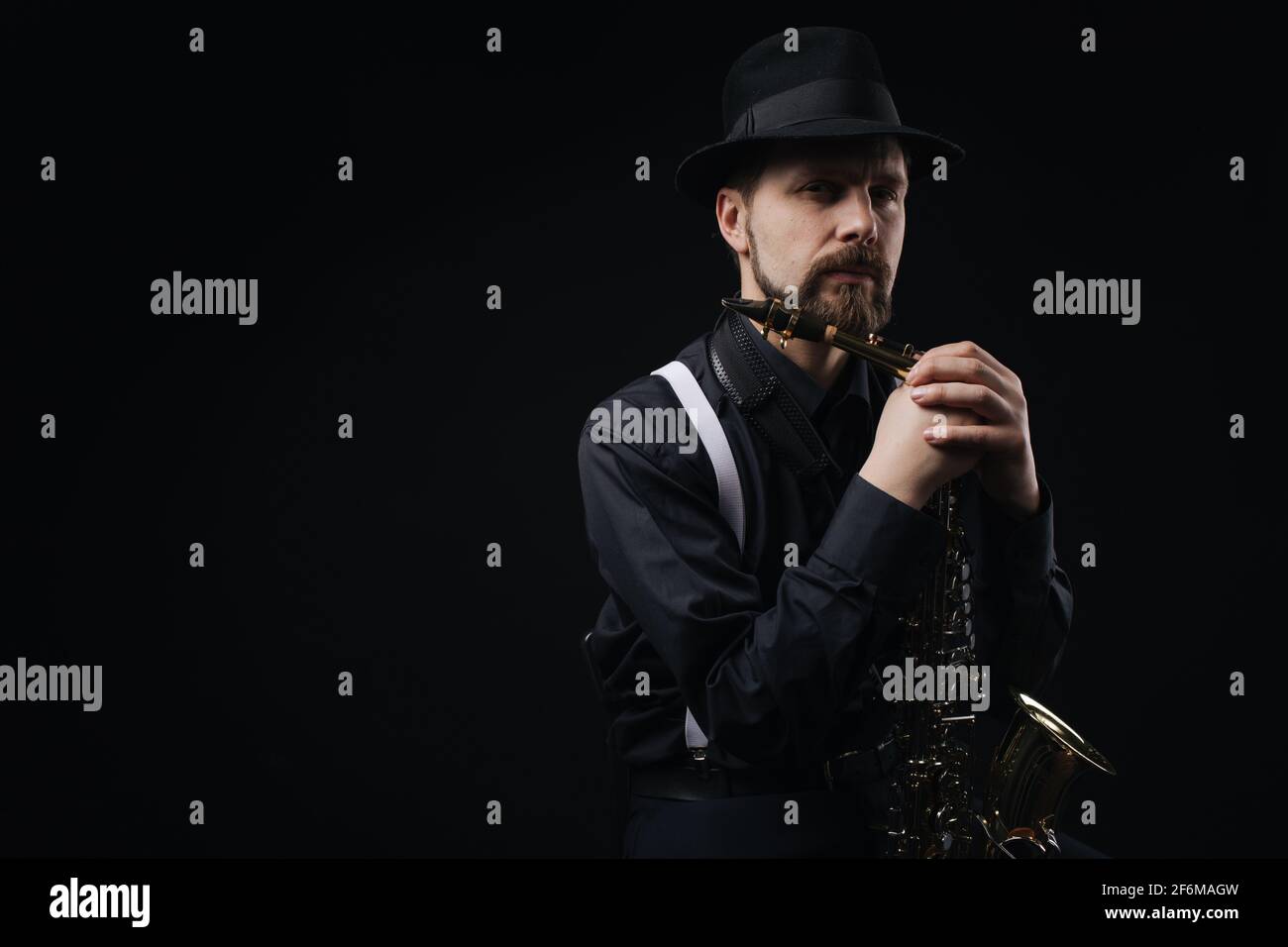 Holding saxophone hi-res stock photography and images - Alamy