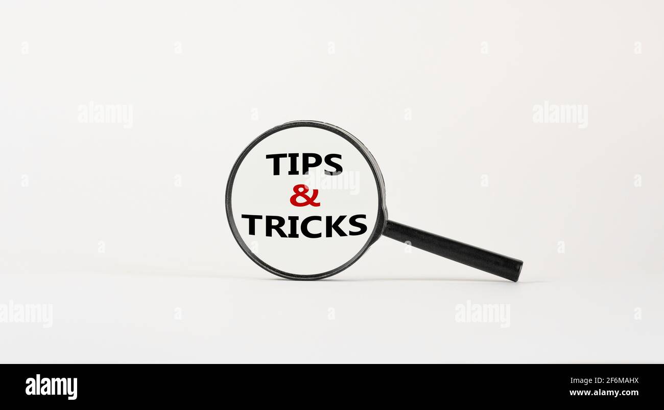 Tips and tricks symbol. Magnifying glass with words 'Tips and tricks ...