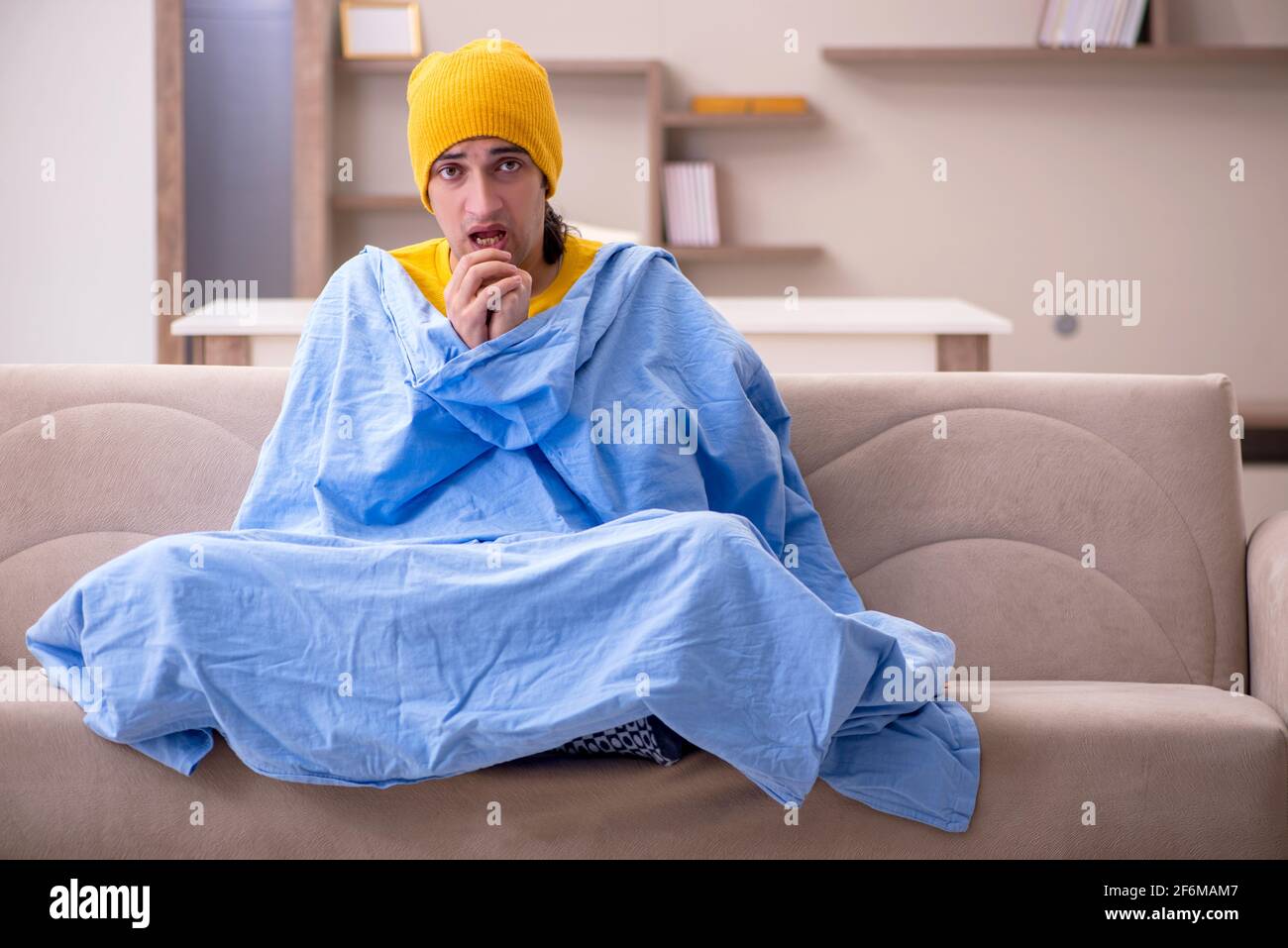 Young man student suffering at home Stock Photo - Alamy