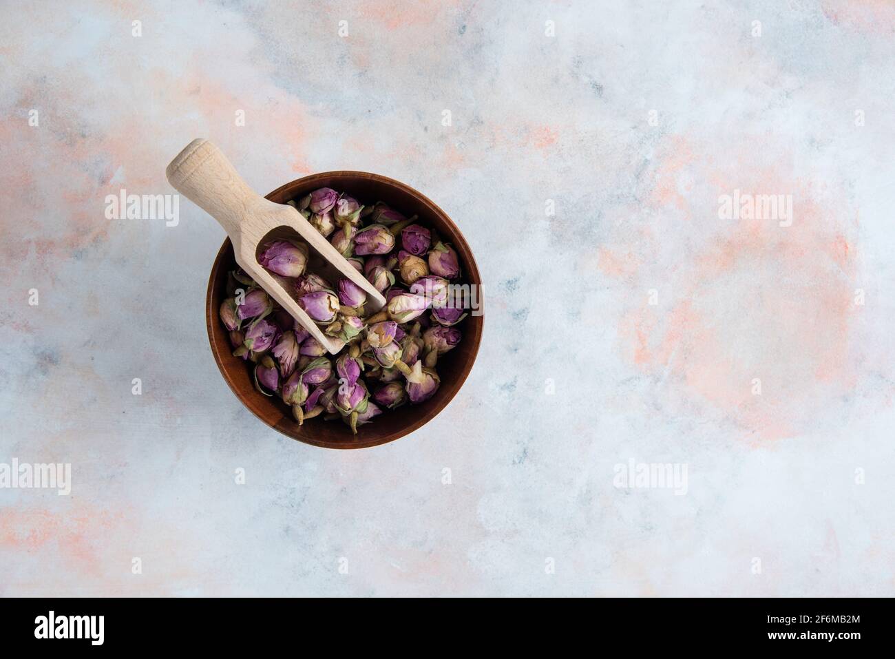 Top view of Dry flowers in wooden bowl over white background Stock ...