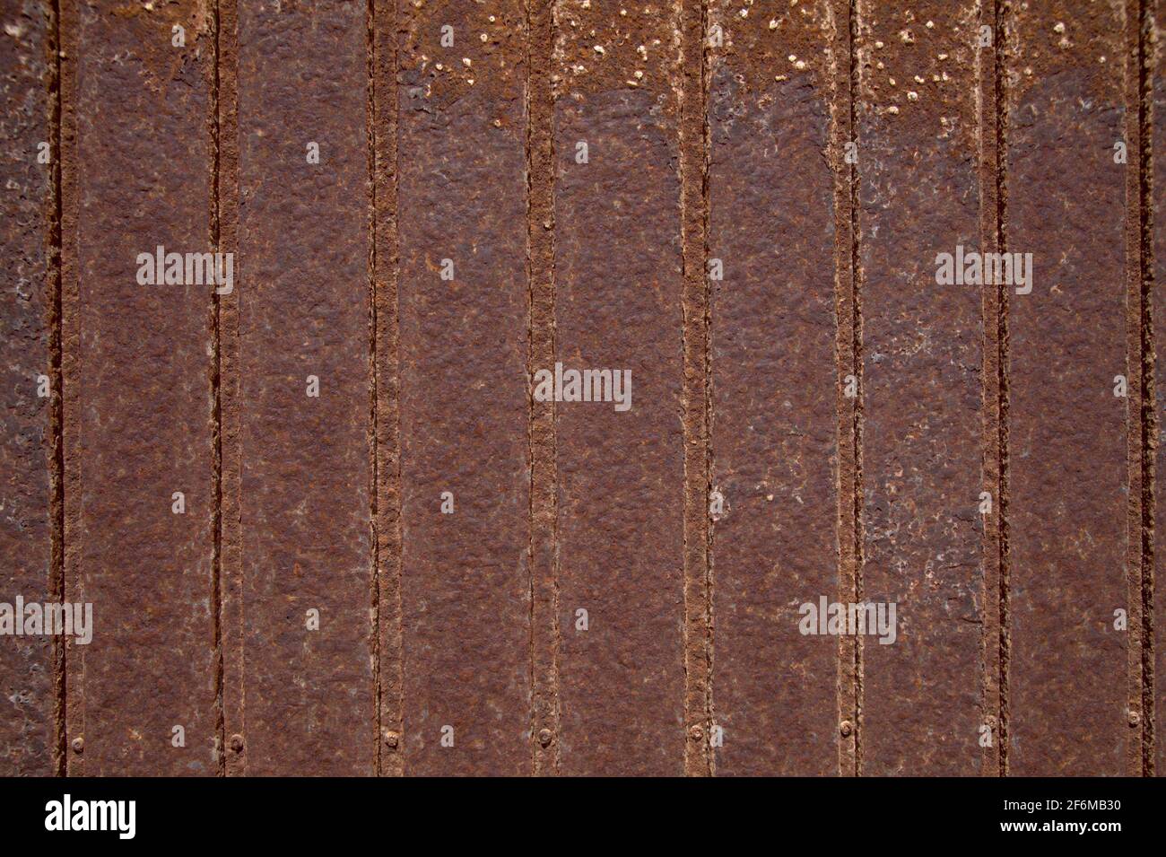 rusty steel gate with vertical slates macro background Stock Photo - Alamy