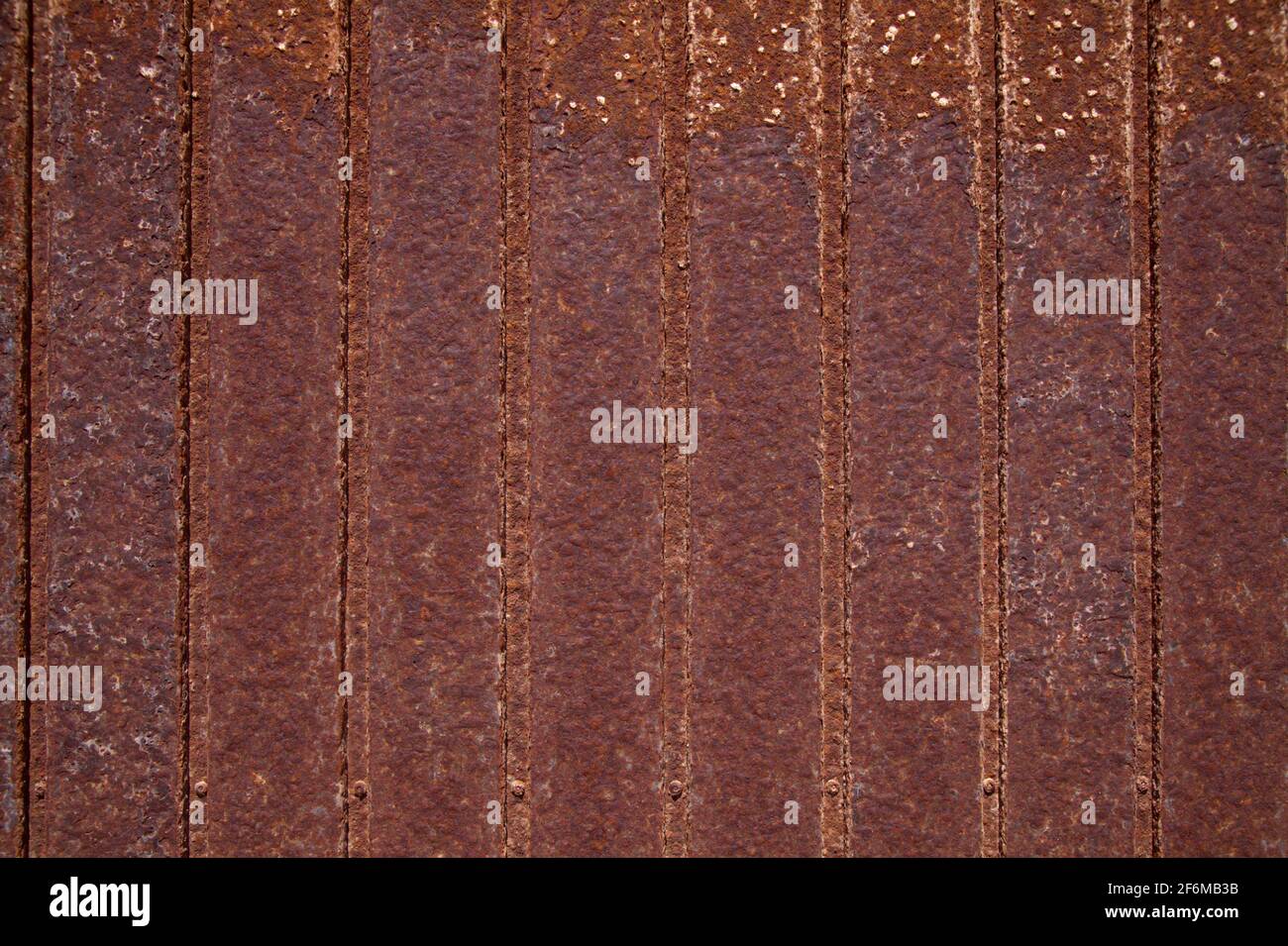 rusty steel gate with vertical slates macro background Stock Photo - Alamy