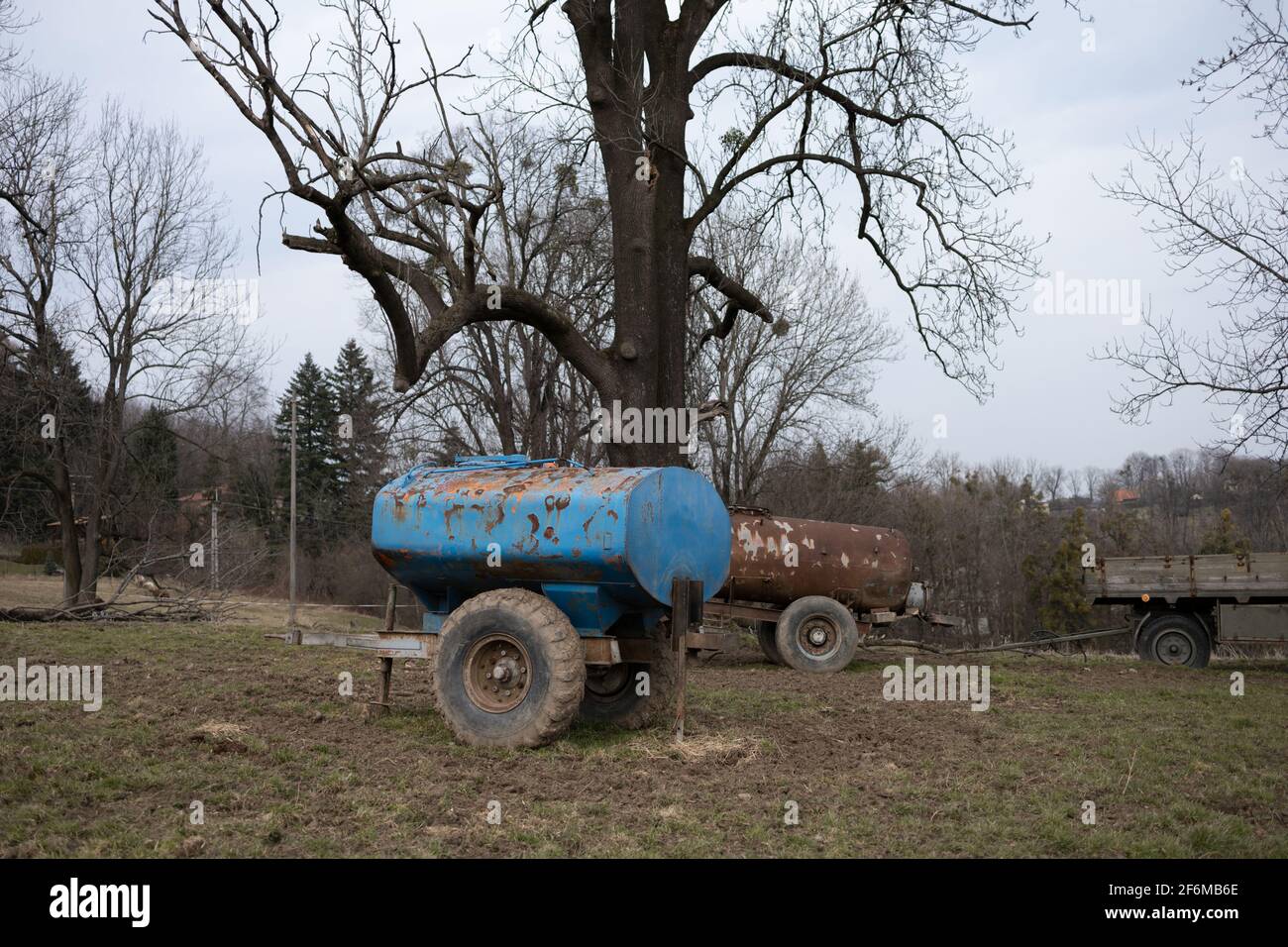 Old, faded, tarnished and rust tank and cistern on the field. Authentic ...