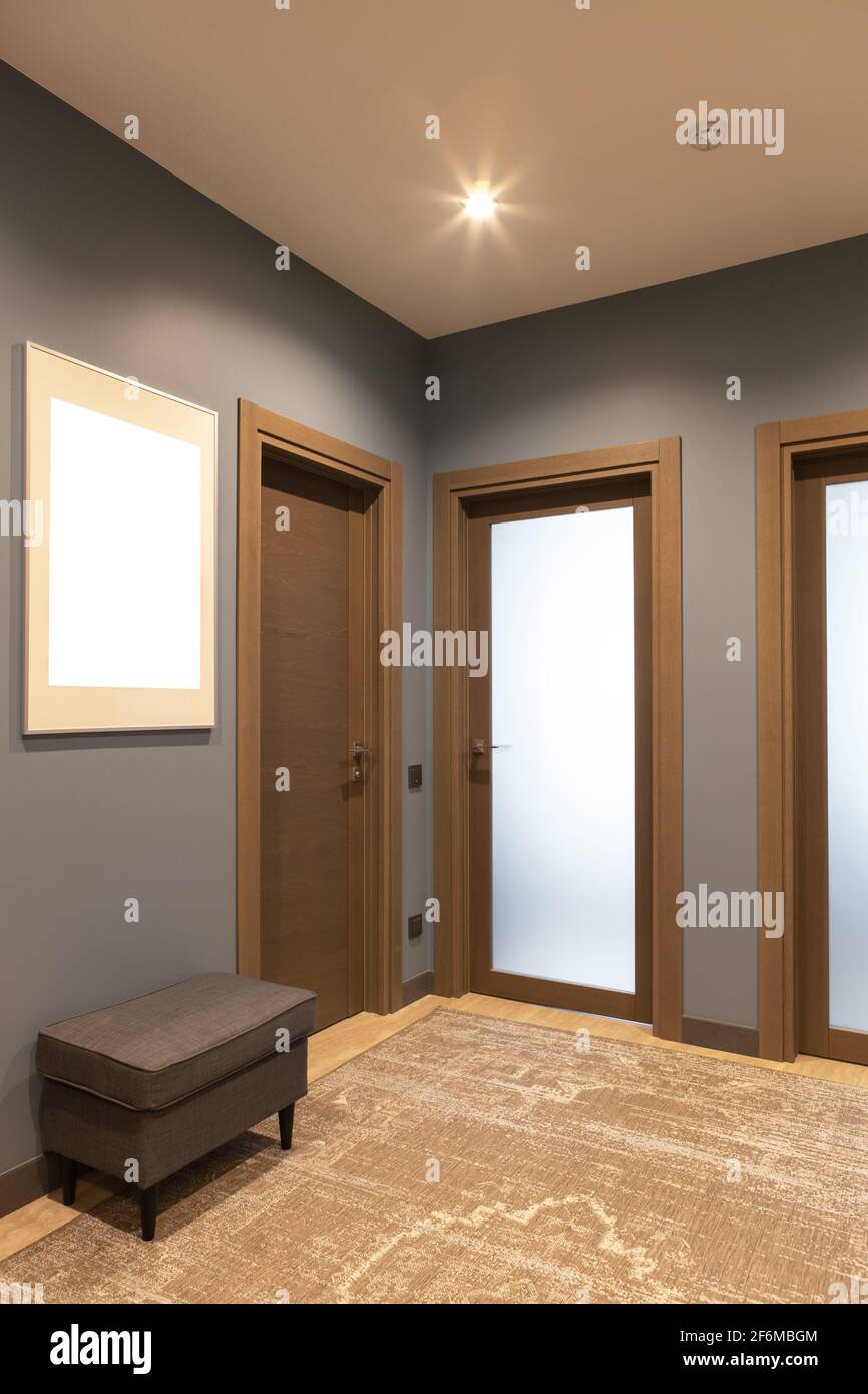 Modern entrance hallway in neutral shades of brown and gray. tones. On ...