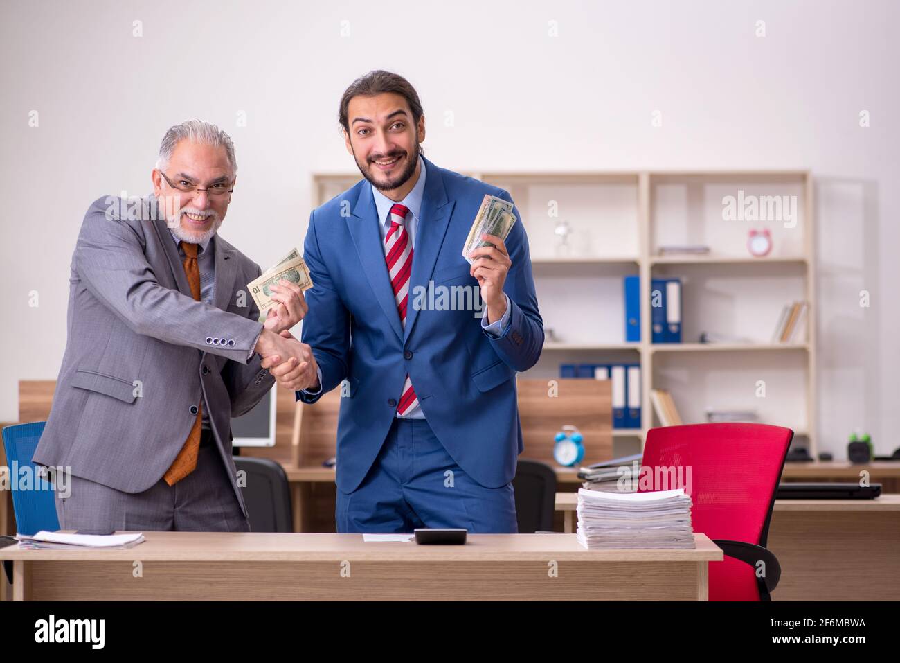 Giving salary to employees hi-res stock photography and images - Alamy