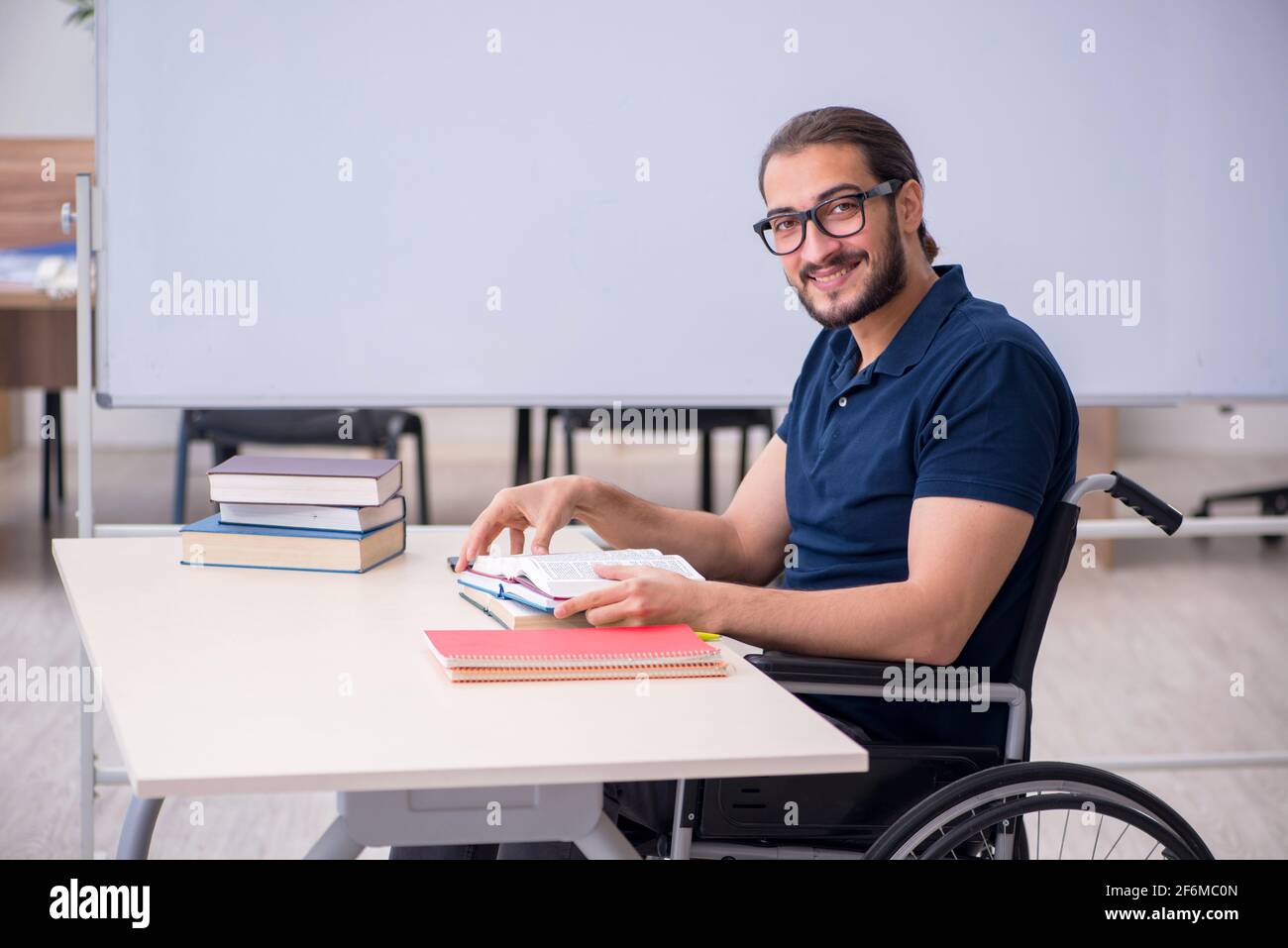 Young handicapped student in the classroom Stock Photo - Alamy
