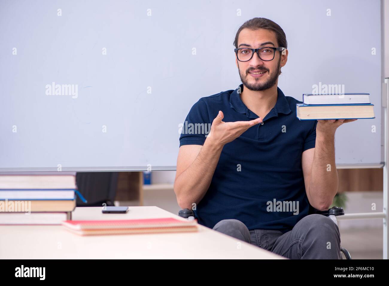 Young handicapped student in the classroom Stock Photo - Alamy