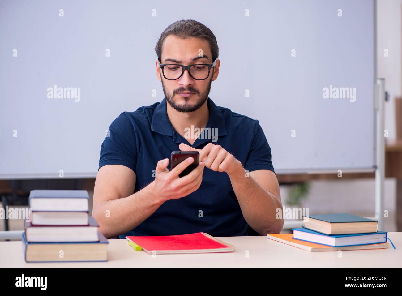 Young handicapped student in the classroom Stock Photo - Alamy