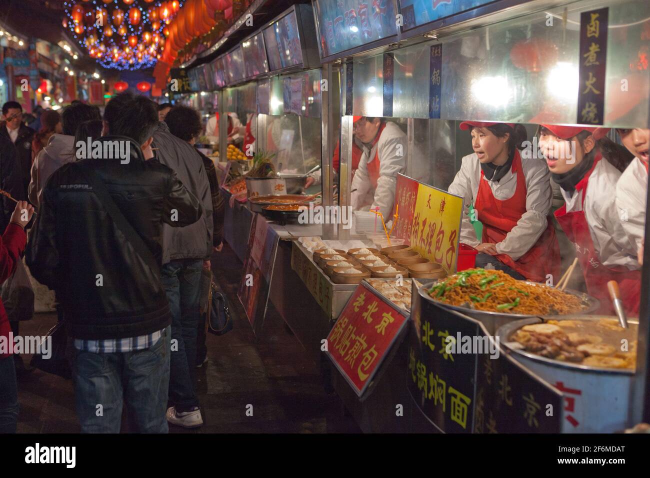 China Beijing Visitors walk past hawkers at Donghuamen Night Market ...