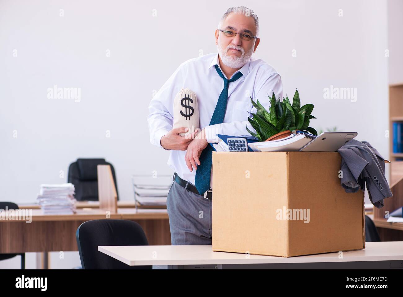 Old employee being fired from his work in retirement concept Stock ...