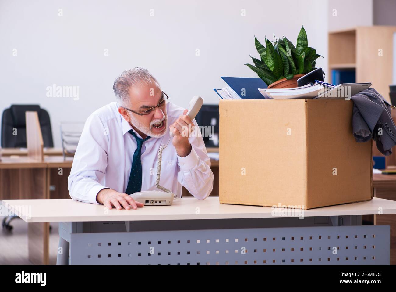 Old employee being fired from his work Stock Photo - Alamy