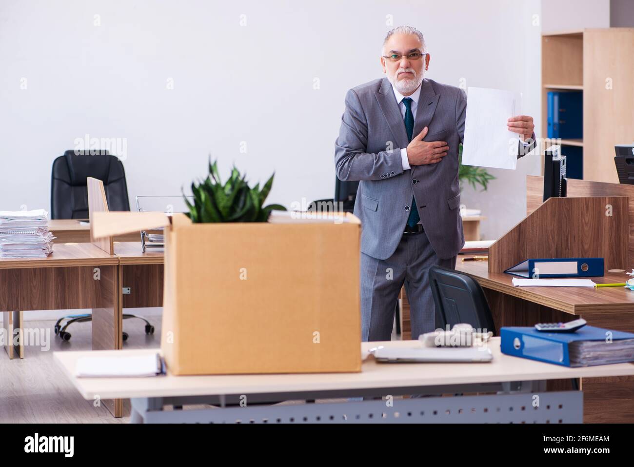 Old employee being fired from his work Stock Photo - Alamy