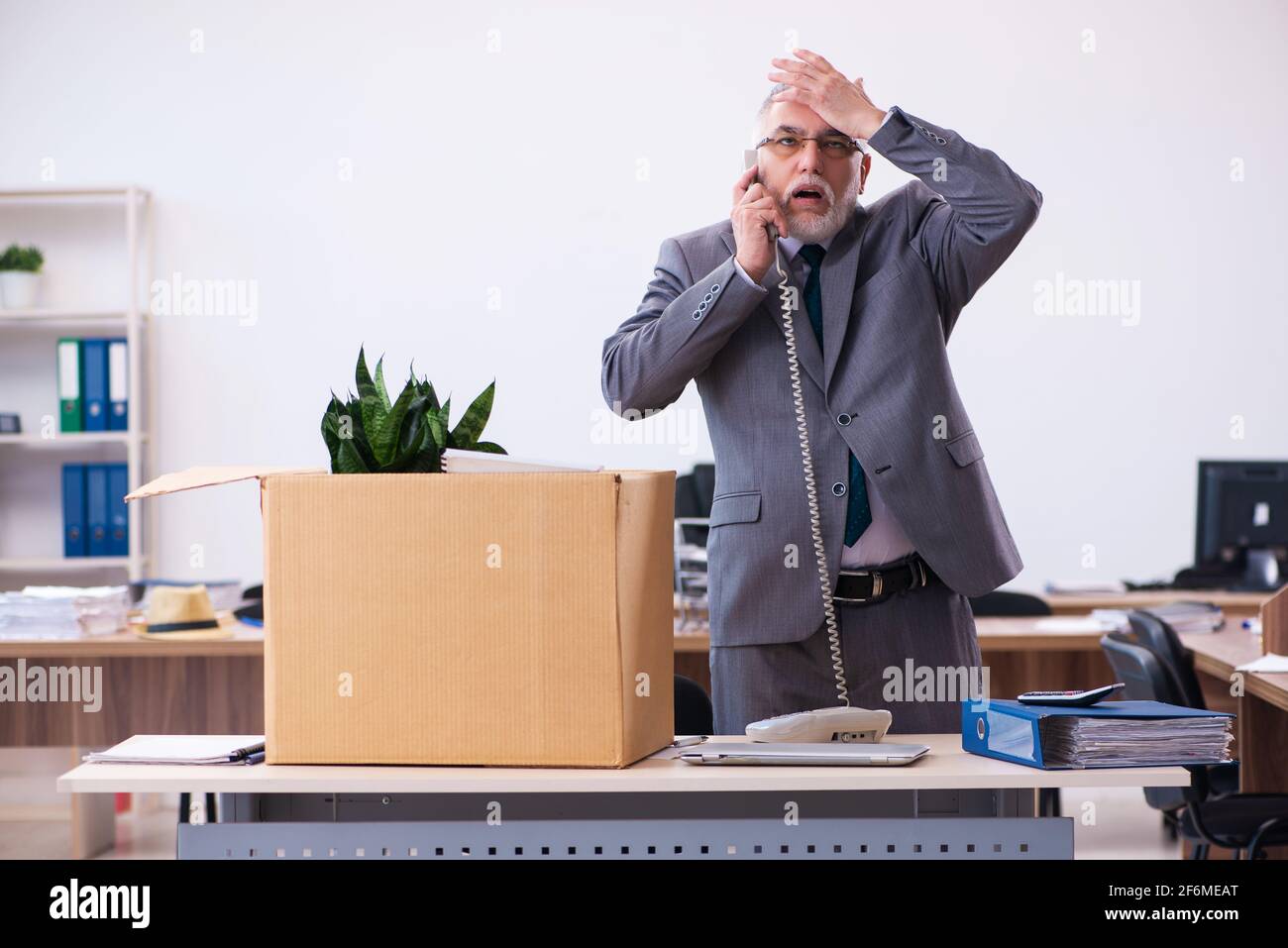 Old employee being fired from his work Stock Photo - Alamy