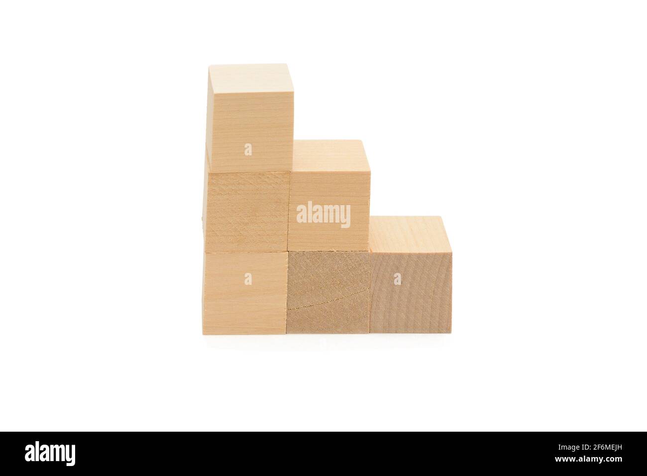 Wooden cubes stacked in staircase with steps. Isolated over white ...