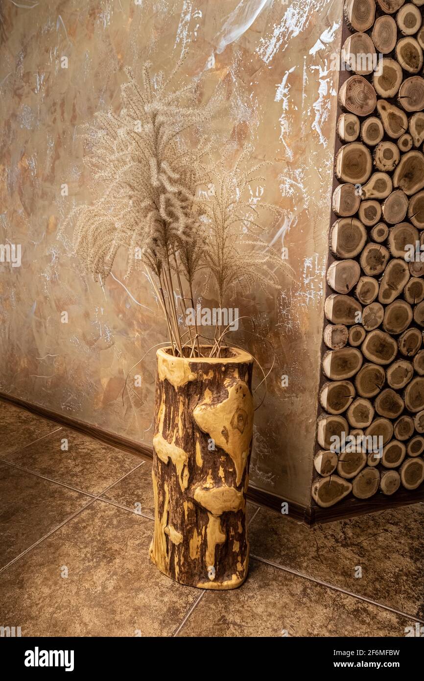 The vase is decorated with patterns of natural origin. Handmade wood ...