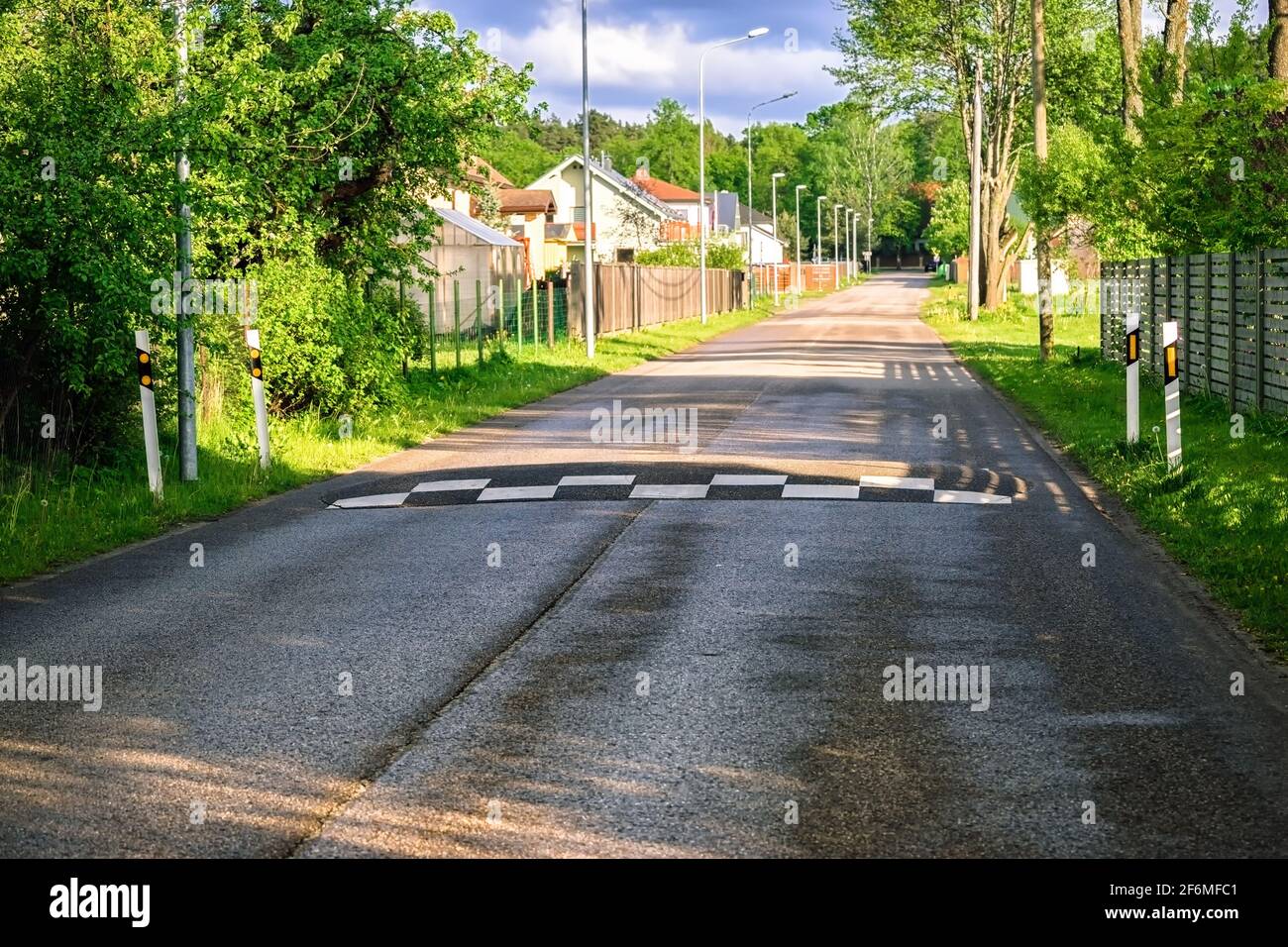 speed bump locality asphalt pavement summer day Stock Photo - Alamy