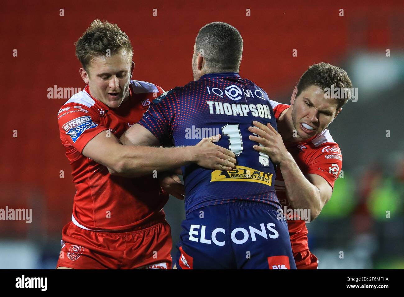 Joel Thompson (11) of St Helens stopped by the tackle of Matt Parcell ...