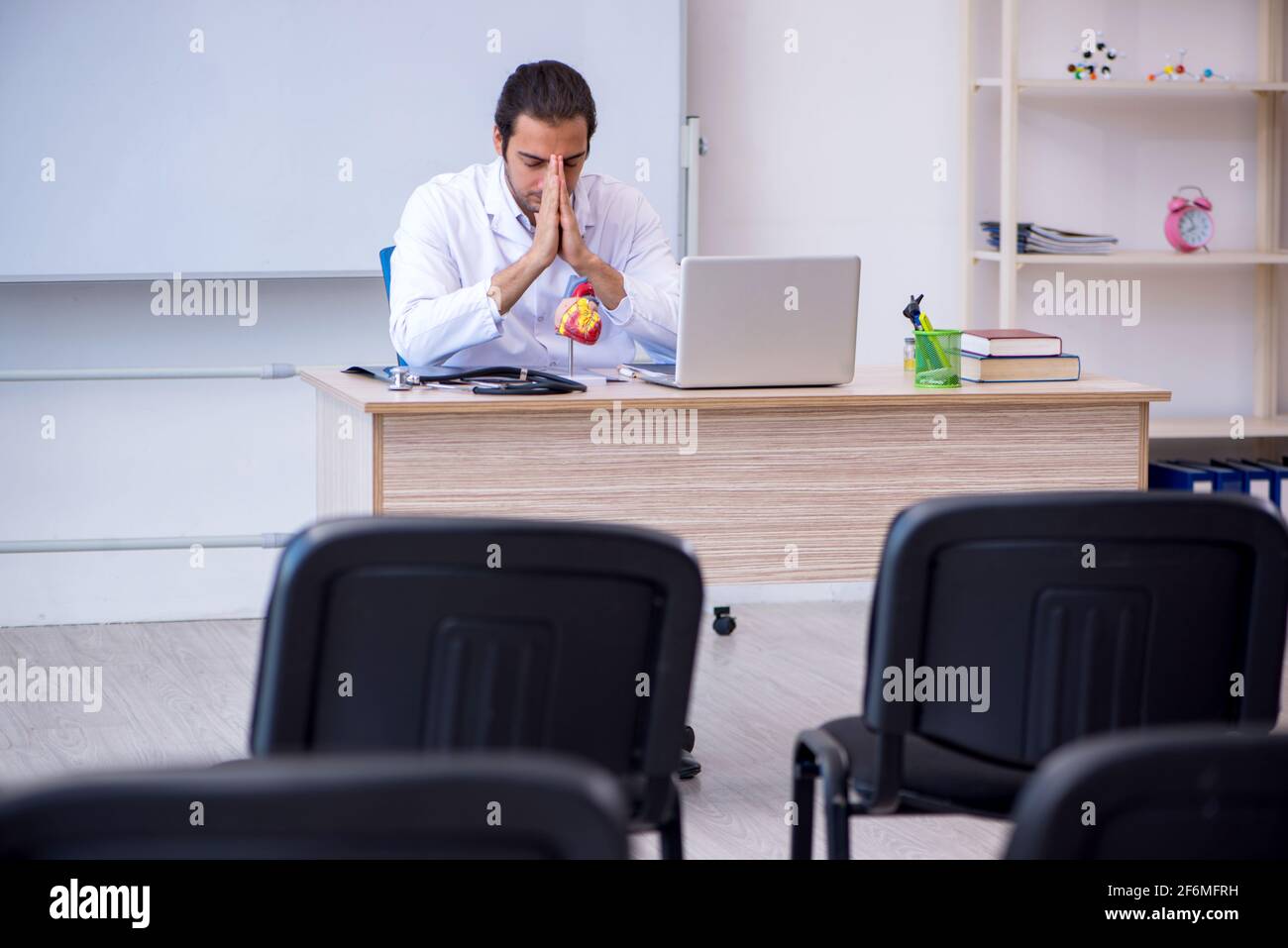 Young doctor giving seminar in the classroom Stock Photo - Alamy