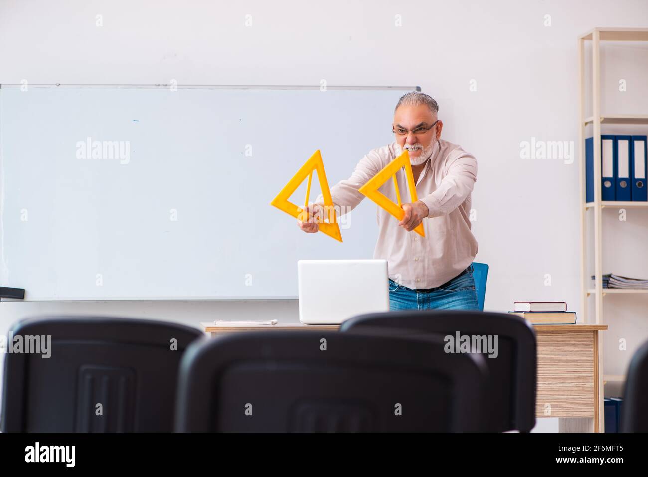Angry teacher and ruler hi-res stock photography and images - Alamy