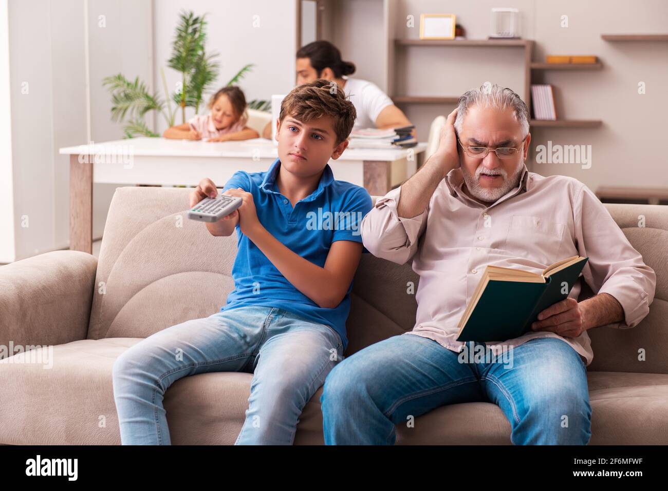 Three generations at home in early development concept Stock Photo - Alamy