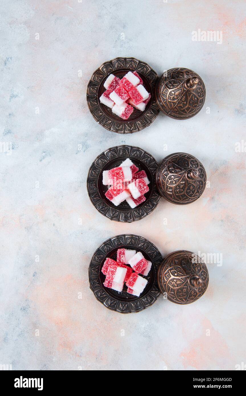 Vertical photo of Candy crockery in a row over white background Stock ...