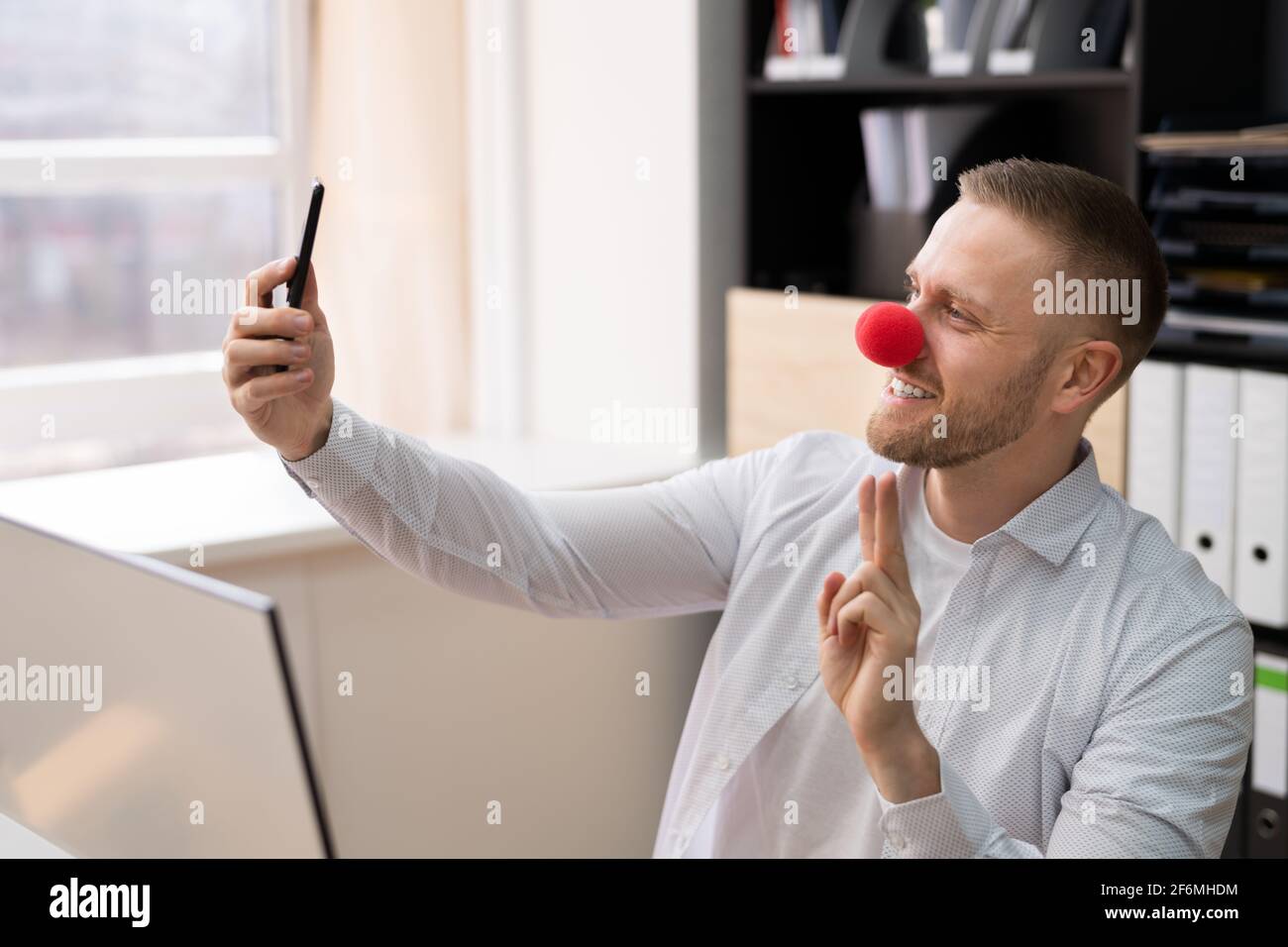 Happy Working People Using Mobile Phone In Office Stock Photo - Alamy