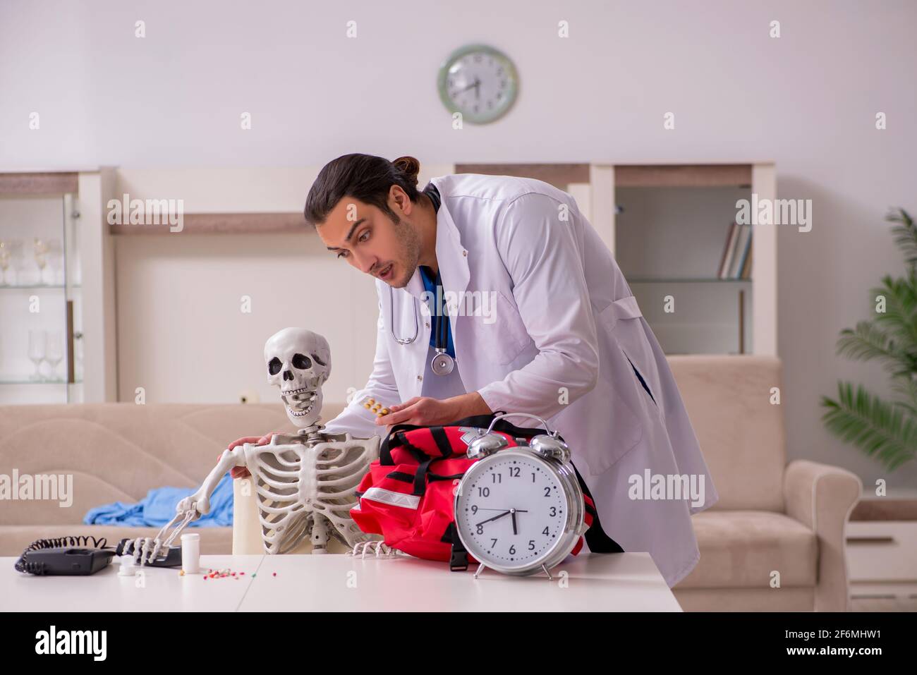 Male paramedic visiting skeleton patient Stock Photo - Alamy