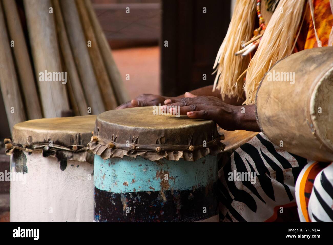 African mans hands playing on African drum Stock Photo - Alamy