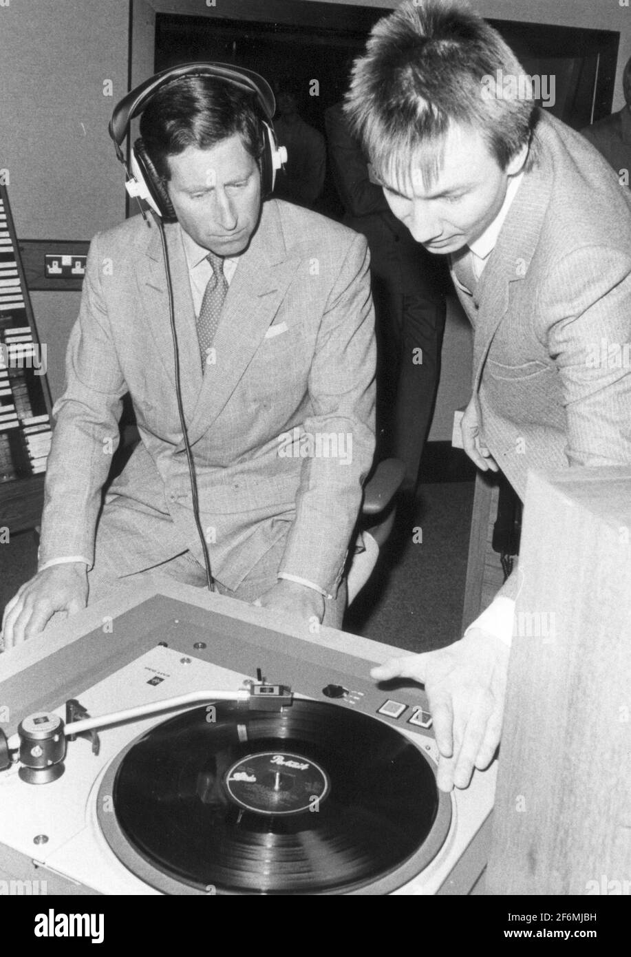 PRINCE CHARLES TRIES HIS HAND AS A DJ WATCHED BY GUY HORNSBY DURING HIS ...