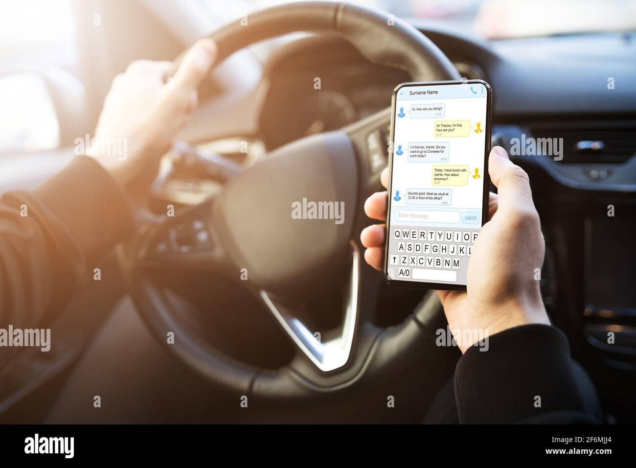 Man Typing Text Message On Mobile Phone While Driving Car Stock Photo ...